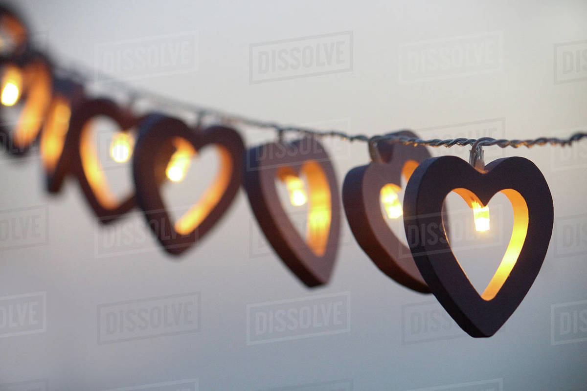 Heart shaped string lights hanging in a row - Royalty-free Stock Photo ...