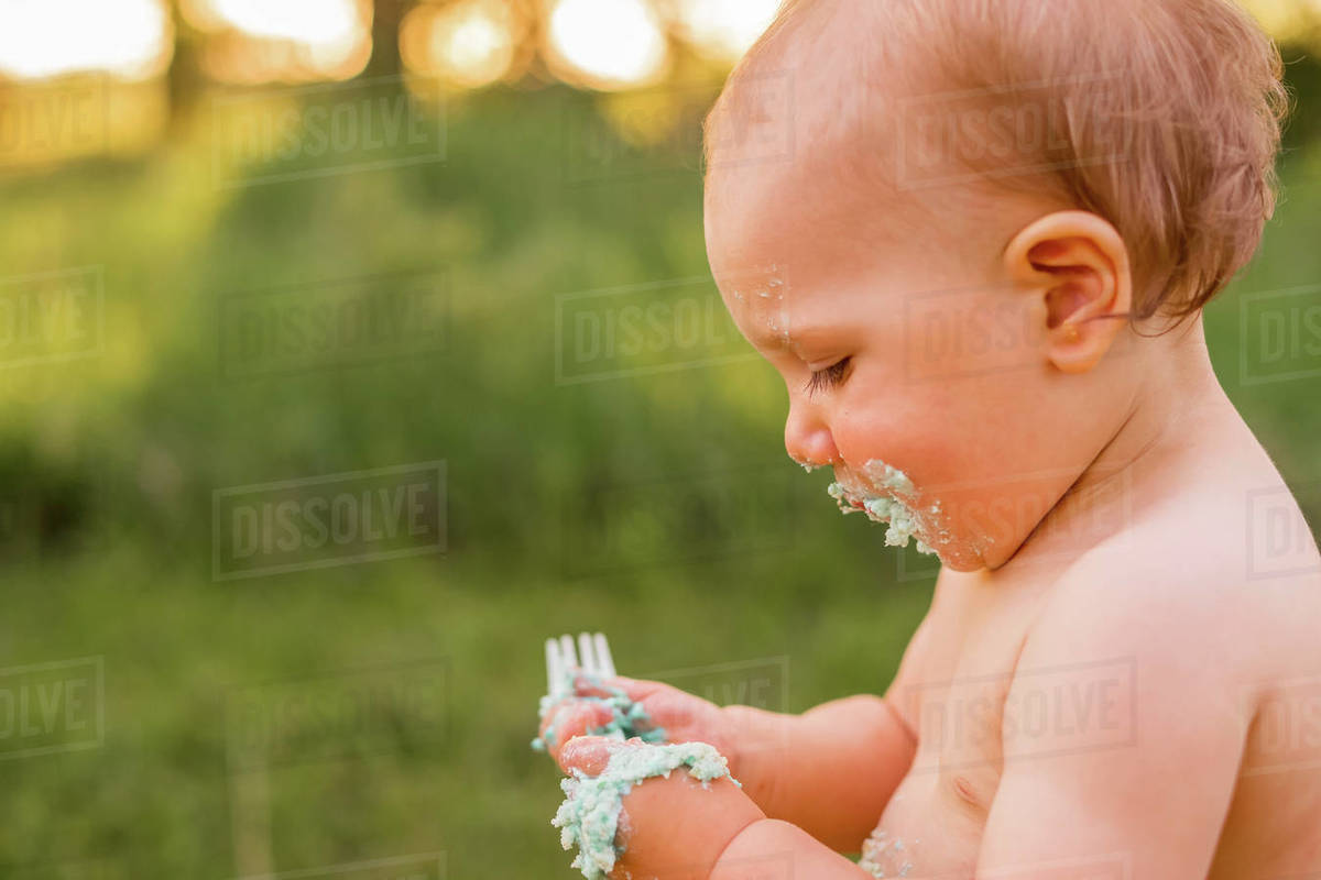 Portrait of a baby boy with cake on his face - Royalty-free Stock Photo ...