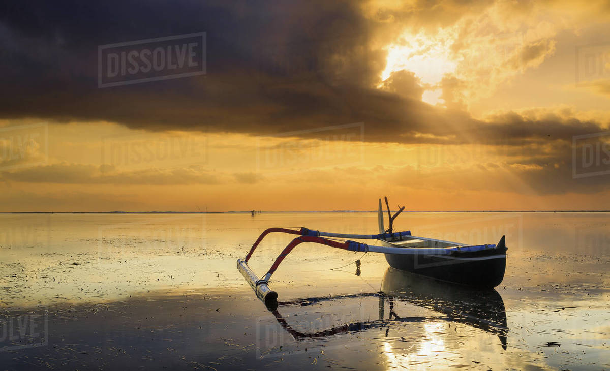 Jukung boat on beach at sunset, Sanur, Denpasar, Bali, Indonesia ...