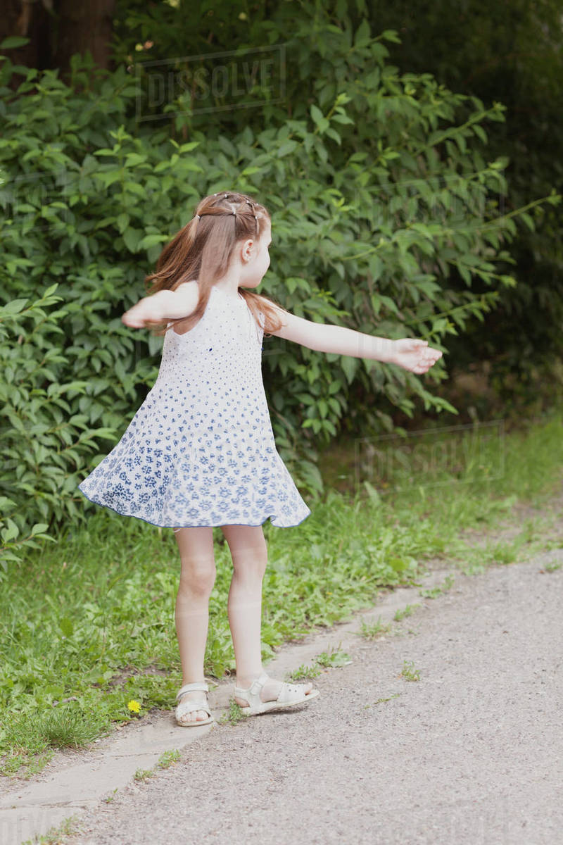 Girl spinning around - Royalty-free Stock Photo | Dissolve