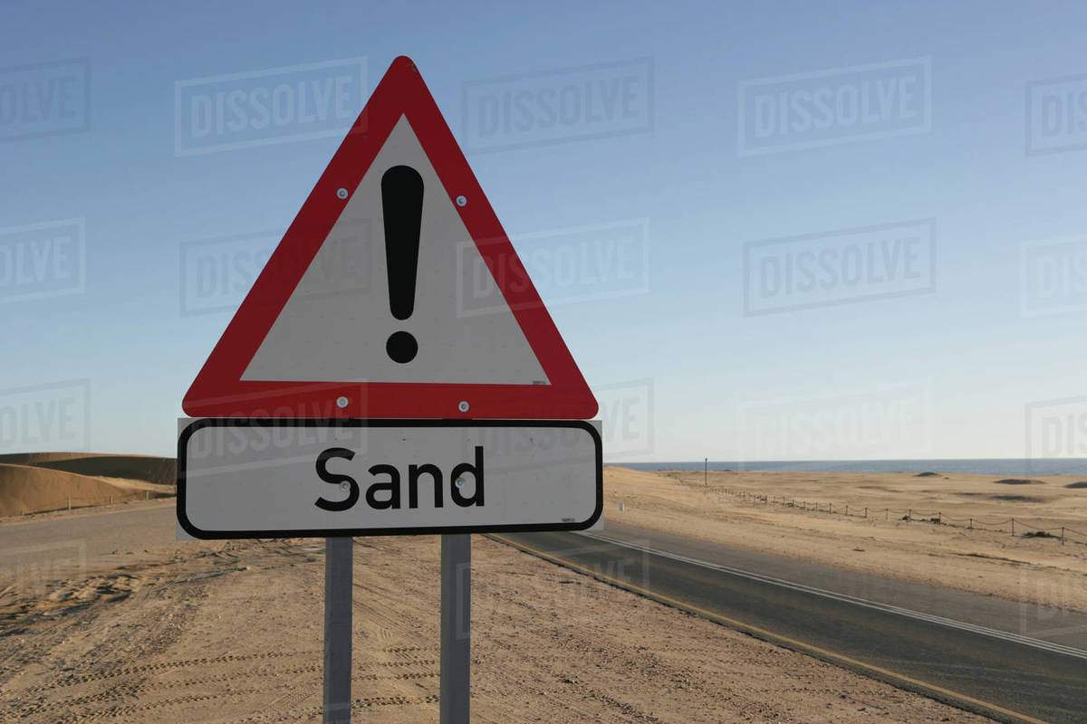Sand warning sign in desert, Namibia - Stock Photo - Dissolve