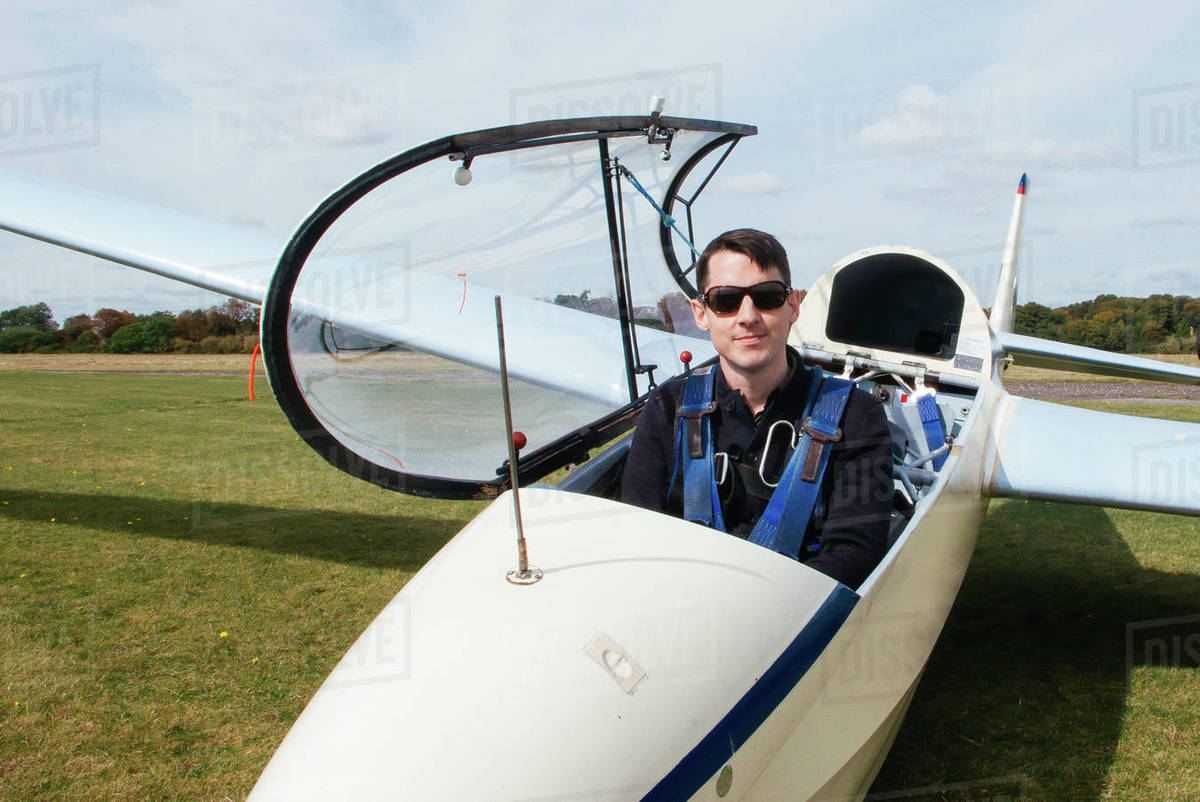 Man in glider before take off - Stock Photo - Dissolve