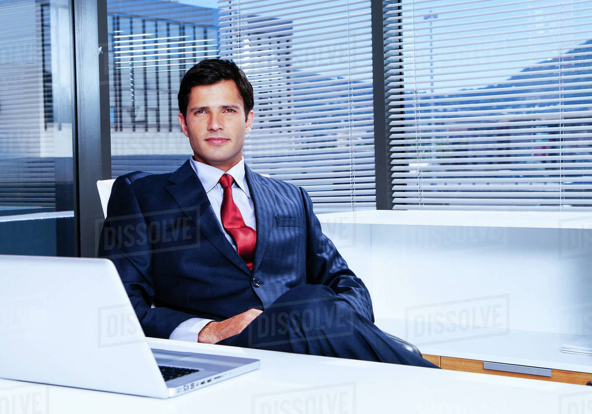 Businessman a desk in the office - Royalty-free Stock Photo | Dissolve