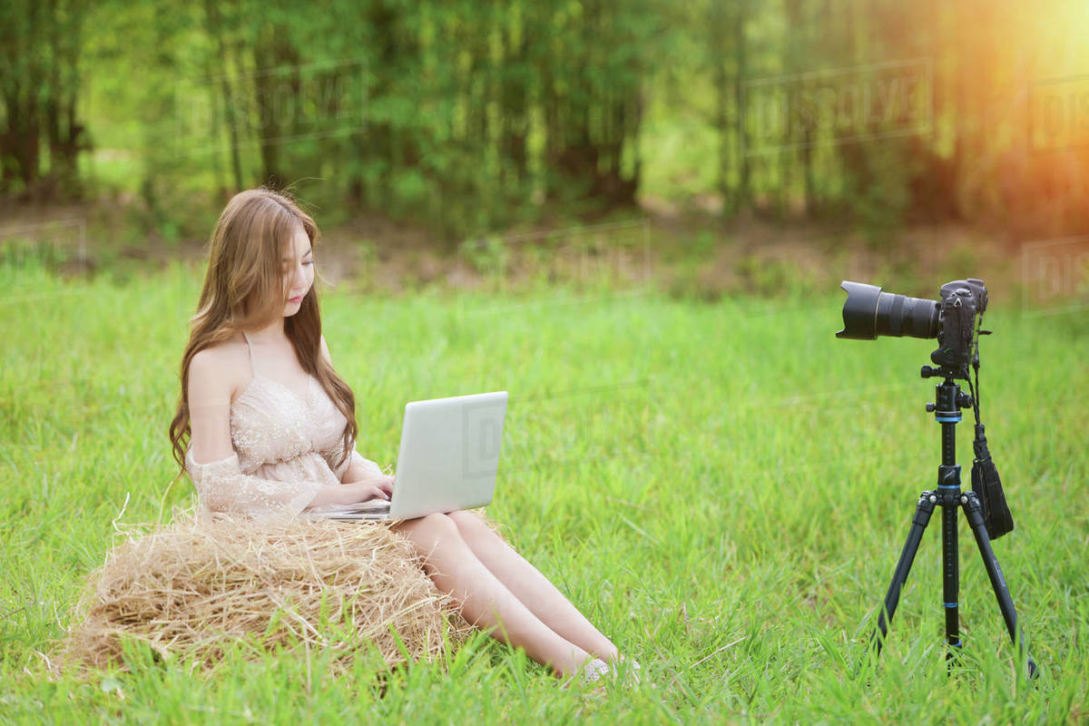 Vlogger filming outdoors, Thailand - Royalty-free Stock Photo | Dissolve