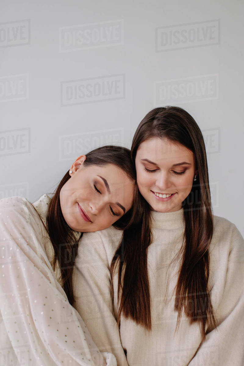 Portrait of two smiling sisters - Royalty-free Stock Photo | Dissolve