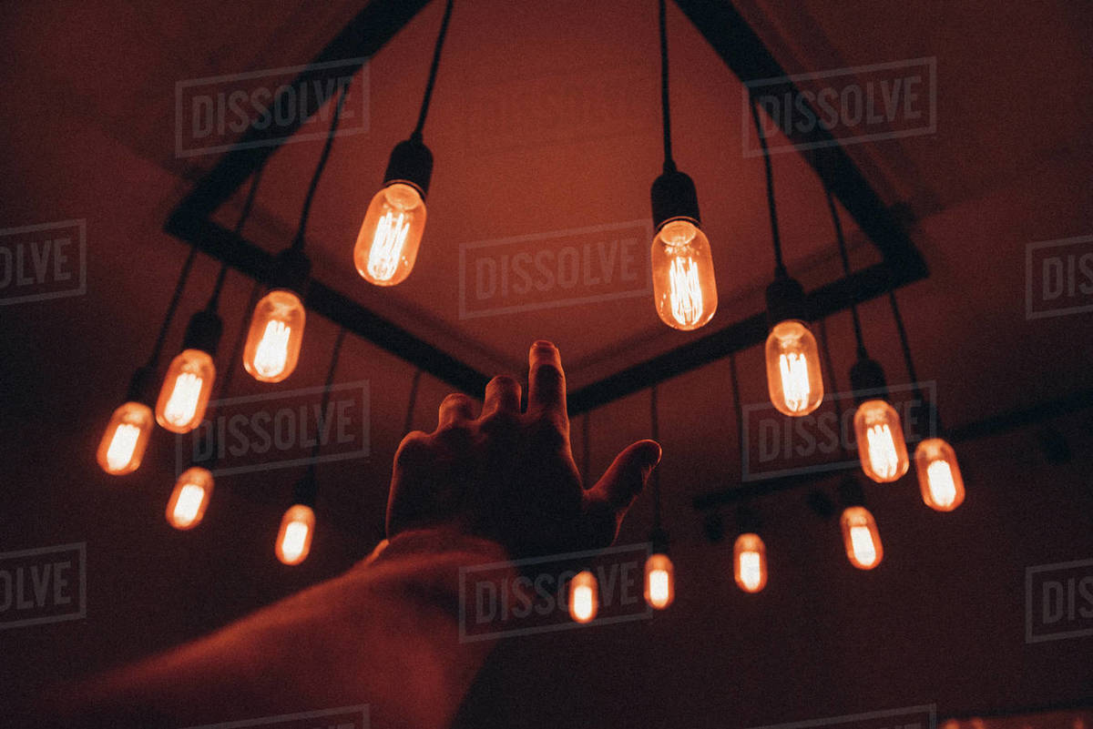 Human hand reaching for ceiling lights - Royalty-free Stock Photo ...