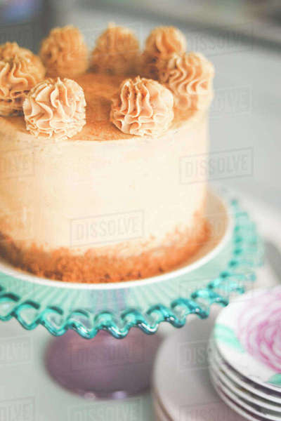 Sponge layer cake with buttercream icing on a cakestand - Stock Photo ...