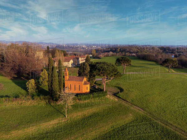 Aerial view of church in rural landscape at sunset, Pomelasca, Inverigo ...