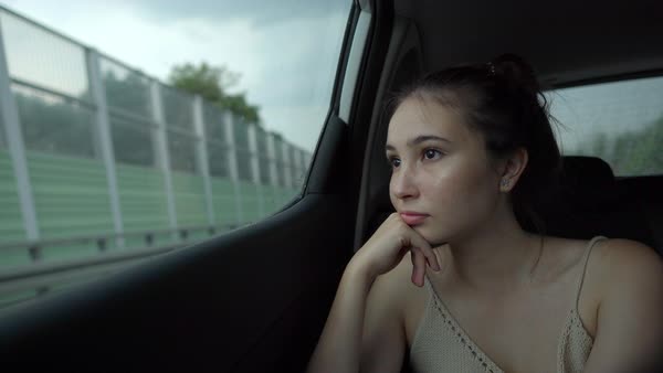 Girl looking through car window during the car ride - 4K Royalty-free ...