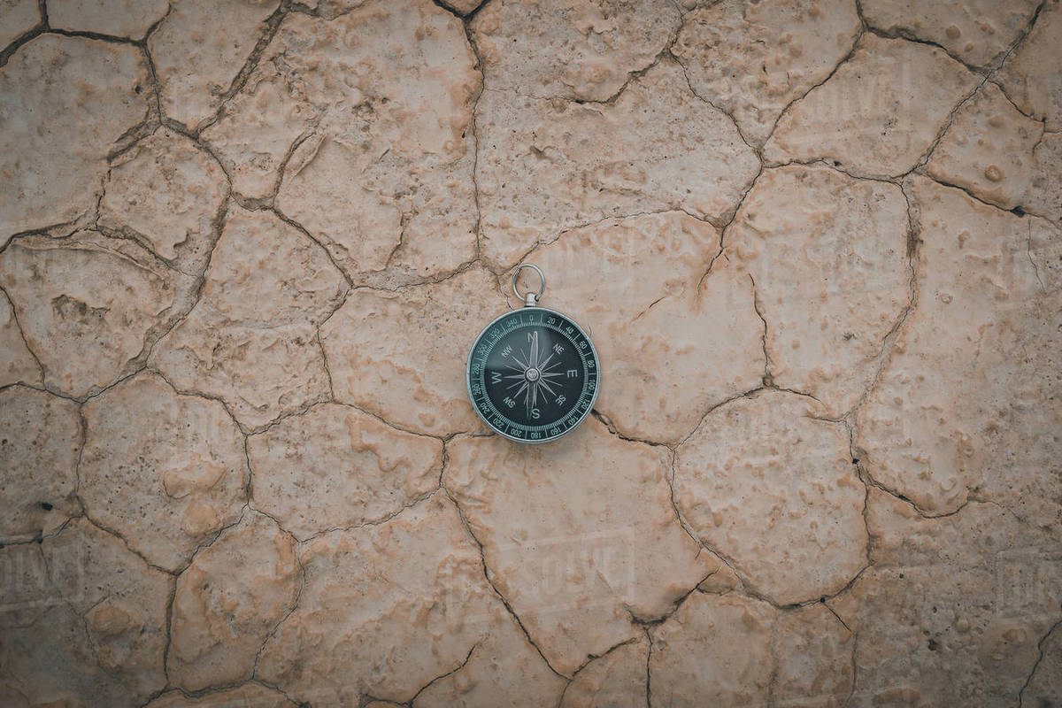 Big compass on dry cracked desert area - Royalty-free Stock Photo ...