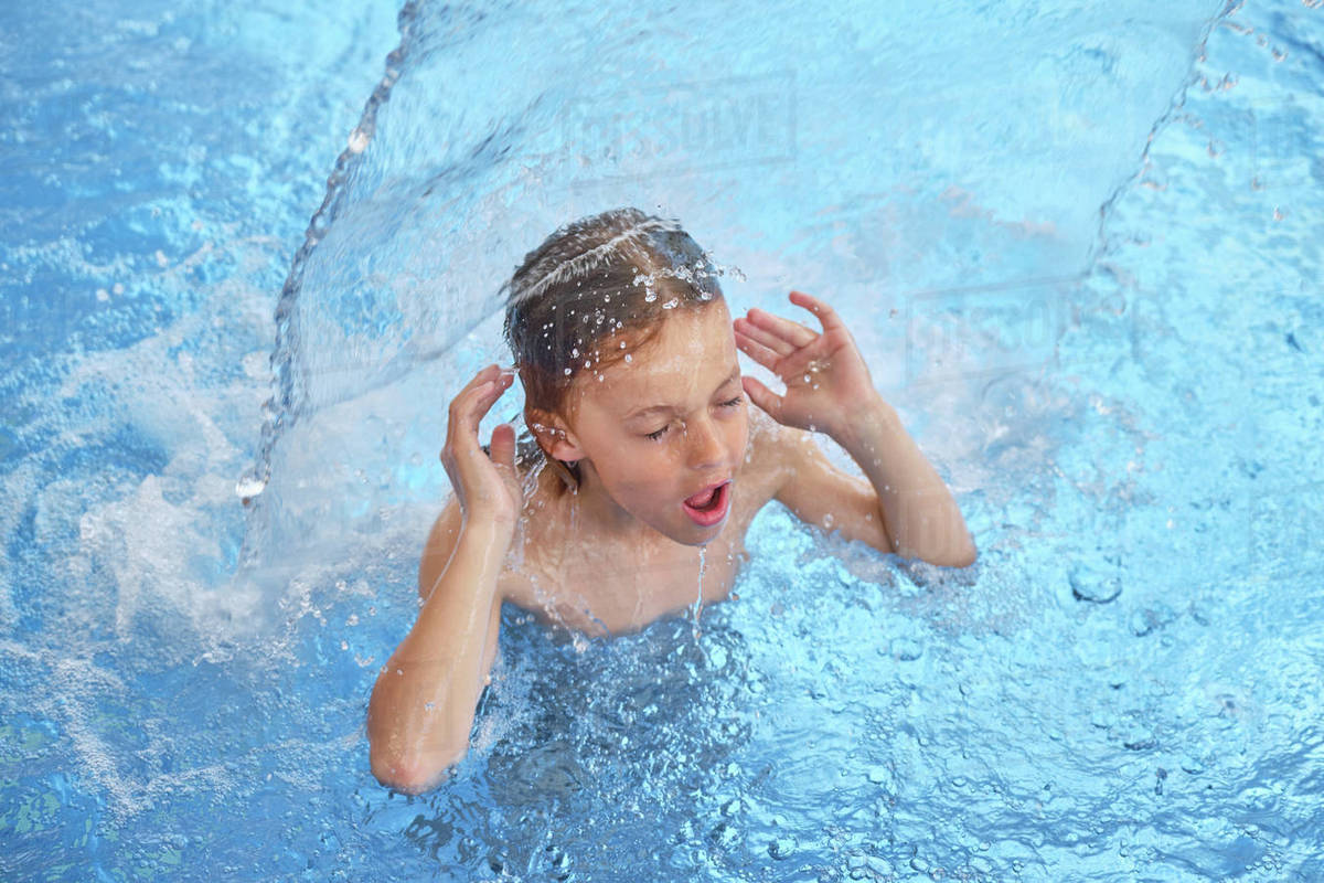 Child gasping for air with closed eyes and open mouth while floating ...