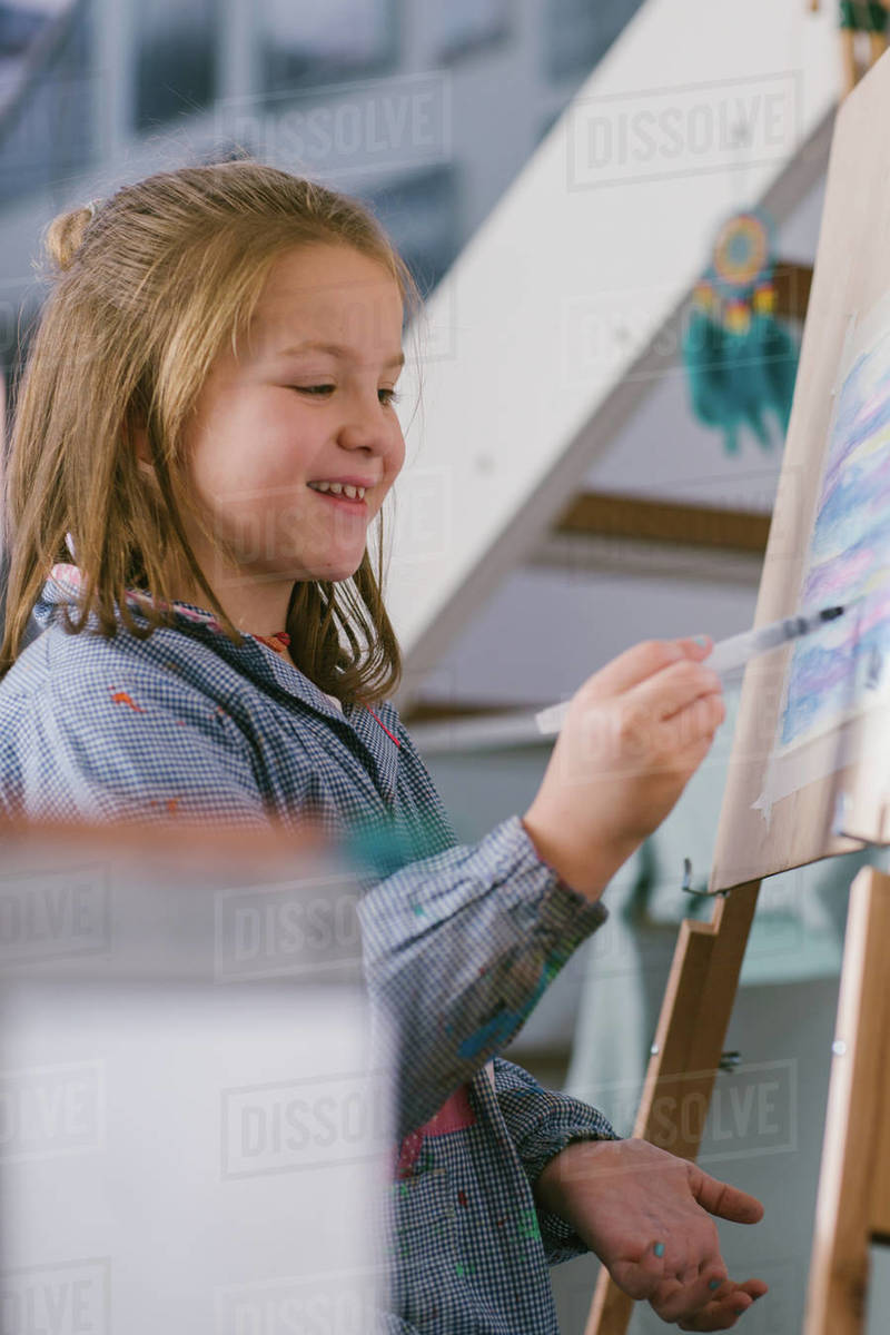 Child drawing on canvas - Royalty-free Stock Photo | Dissolve