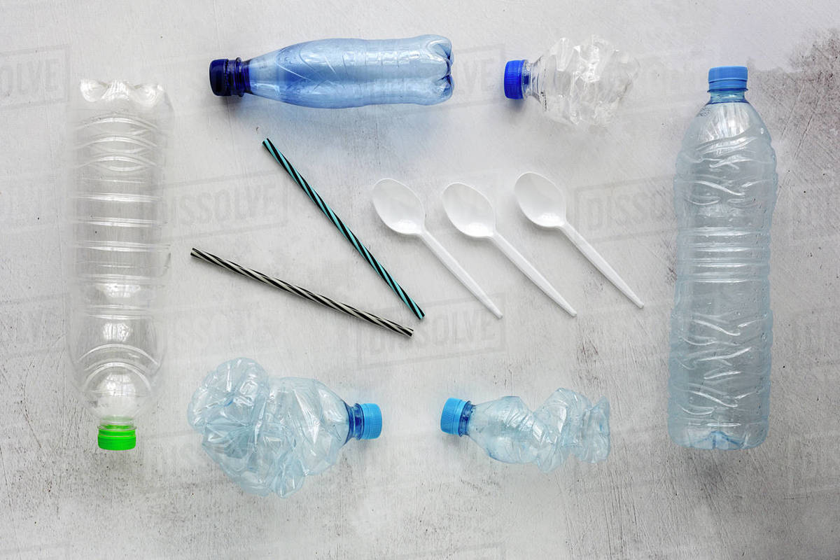 Top view of plastic bottles and boxes arranged on white background ...