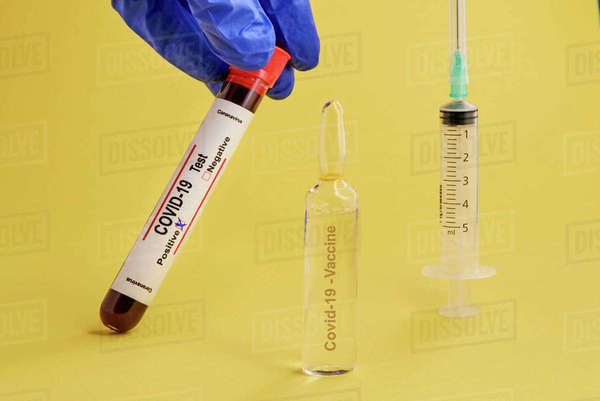 Crop anonymous doctor in latex gloves holding test tube with blood ...