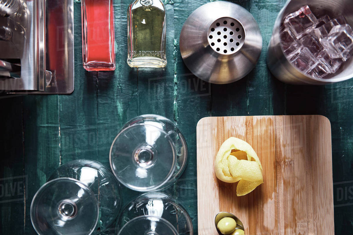 Top view composition of bottles with alcohol drinks and products for ...