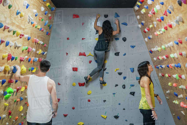 Side view of male and female professional climbers in active wear ...