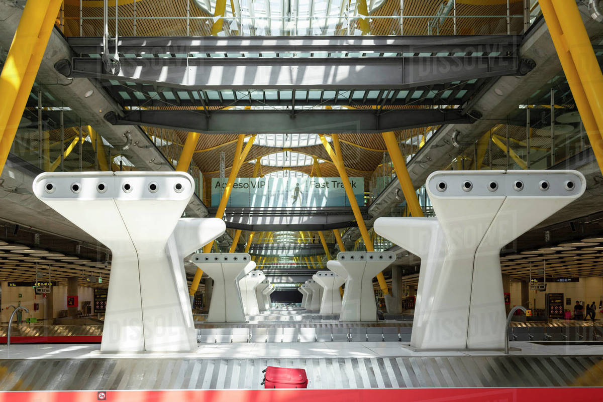 International airport with metal baggage claim area and massive ...