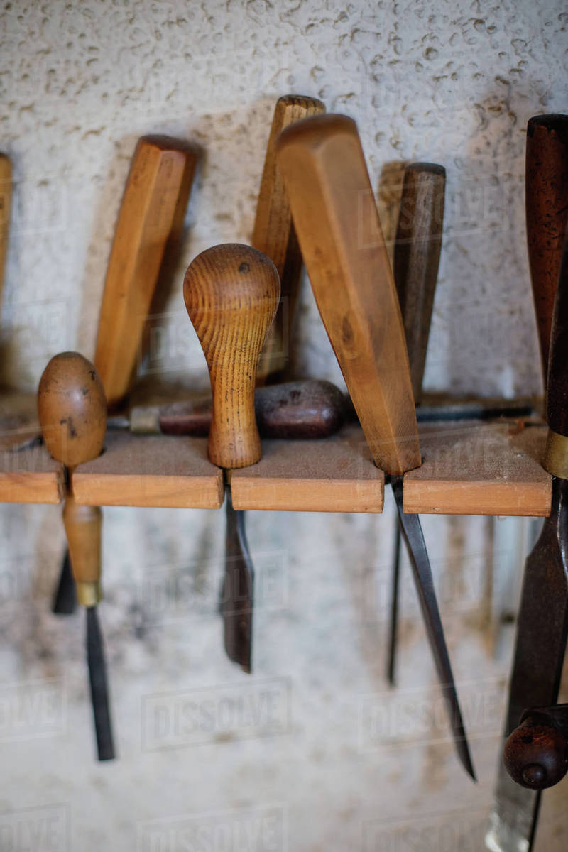 Set of assorted professional carpentry tools with wooden handles placed ...