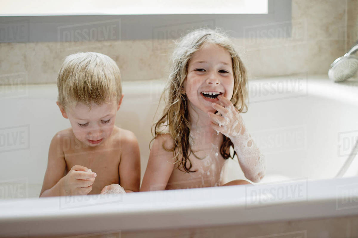 Funny Children Playing With Foam In Bath Stock Photo Dissolve