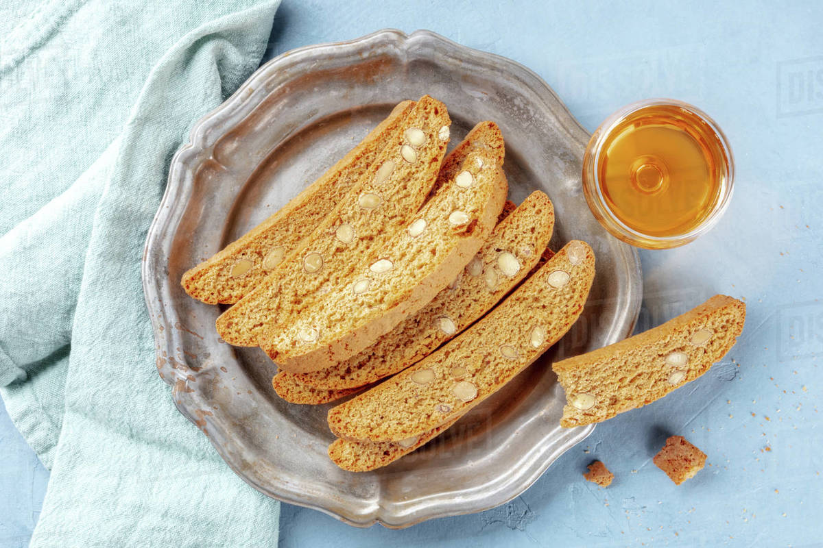 Biscotti, traditional Italian almond biscuits, with a glass of vin ...