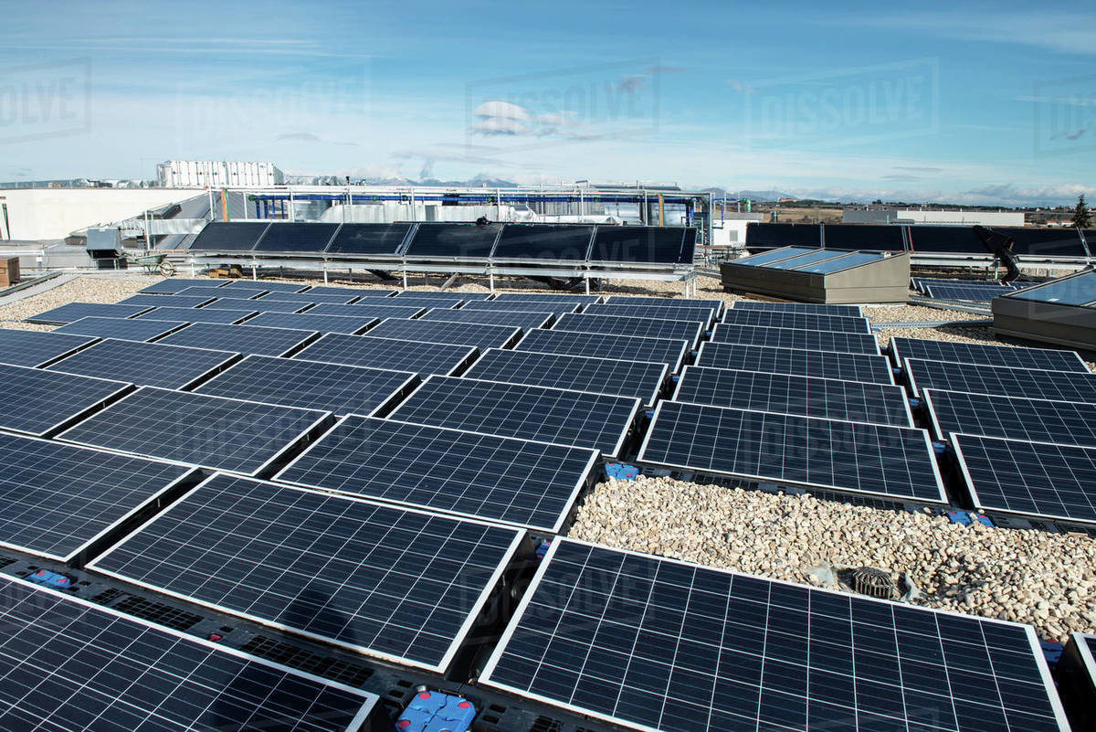 Plantation of modern solar batteries placed on rooftop of building ...