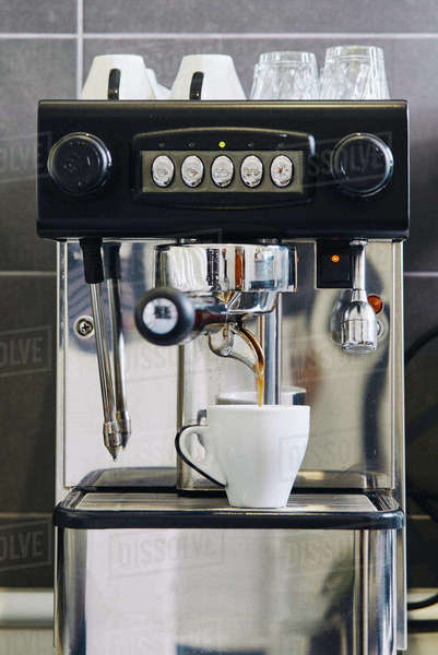 Professional coffee machine made of stainless steel with shiny surface ...