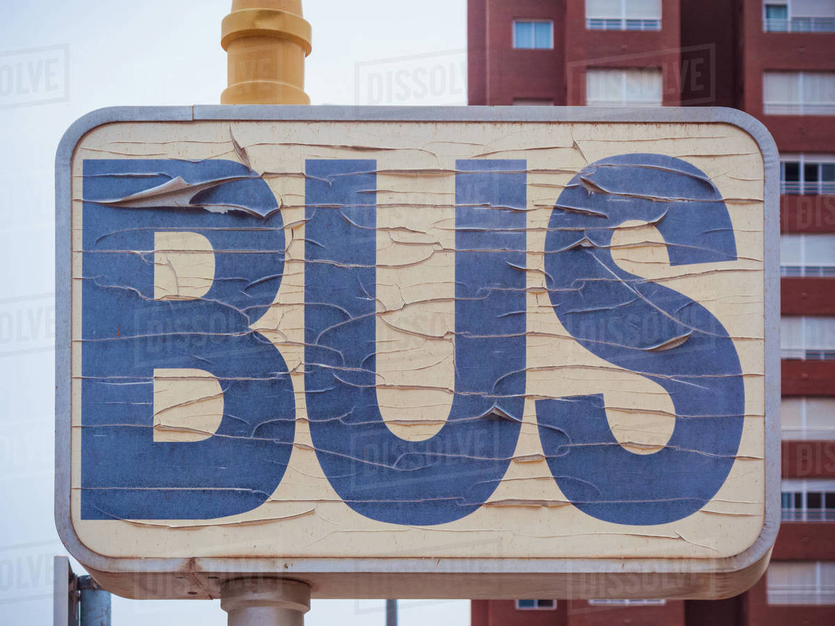 Shabby weathered rectangular road sign indicating bus stop point with ...