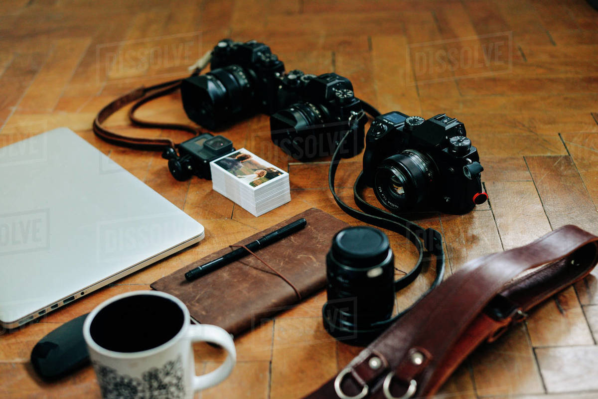 Flat lay of assorted photography devices and gear placed on shabby ...