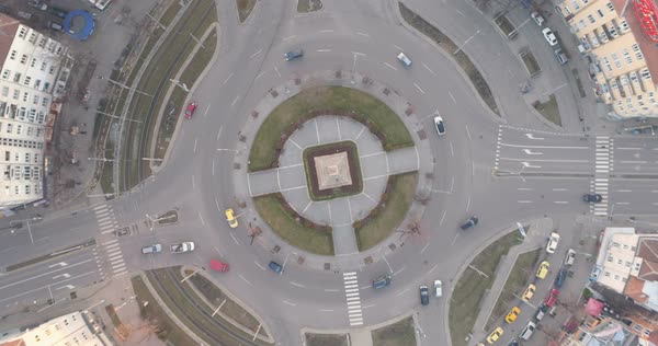 Cars entering road junction roundabout and leaving it in different ...