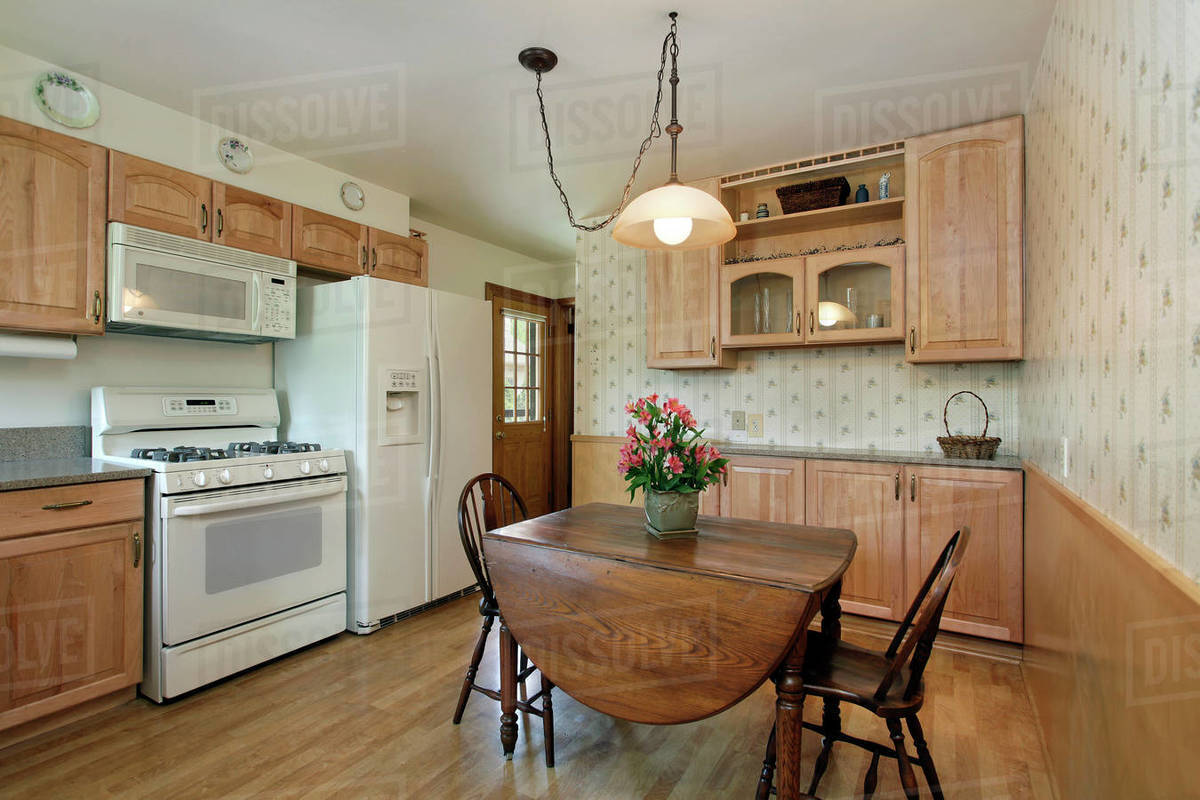 Kitchen in suburban home with oak wood cabinetry - Royalty-free Stock ...