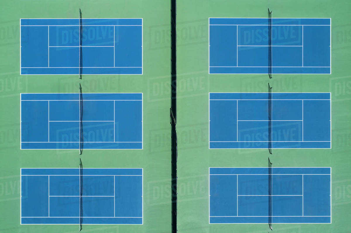 Aerial view of a group of tennis courts at a suburban high school near ...