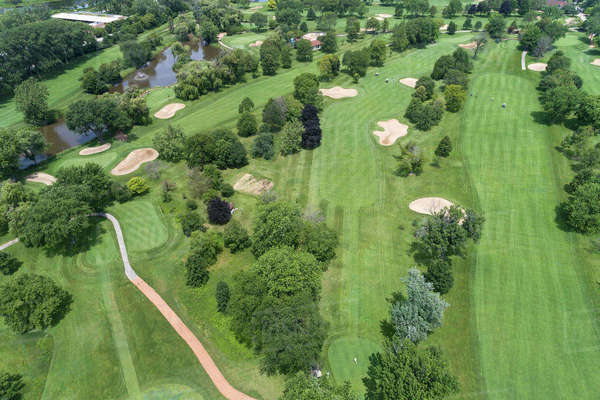 Aerial view of a suburban Chicago golf course with golfers, fairways ...