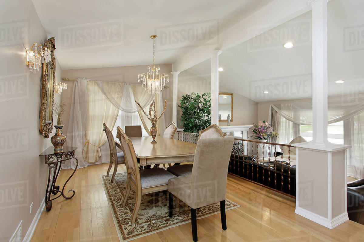 Dining room with lower level living room - Royalty-free Stock Photo ...