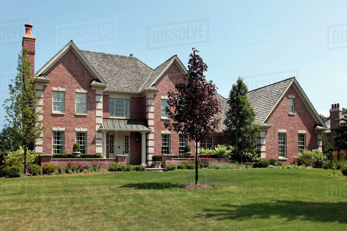 Large brick home with white front columns - Royalty-free Stock Photo ...