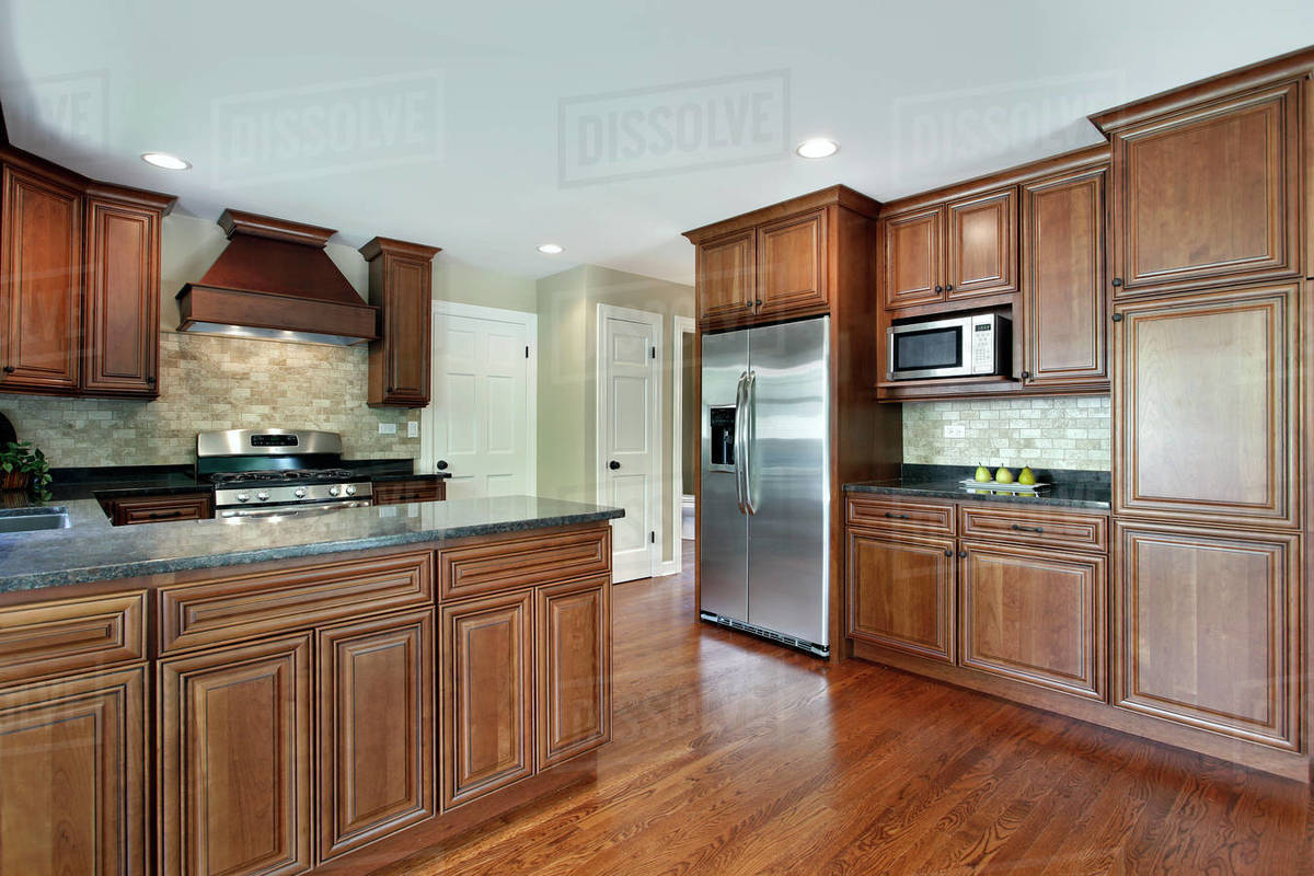 Kitchen in suburban home with oak wood cabinetry - Royalty-free Stock ...
