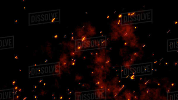 Burning glowing red hot sparks, embers fly from large fire in the night ...