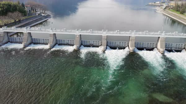 Dam with flowing water at hydroelectric power station located south of ...