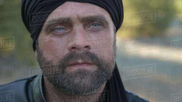 Portrait of a man. Attractive man dressed as a Turkish medieval warrior ...