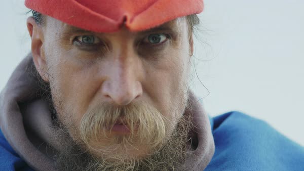 Close-up portrait of a charismatic man dressed as a medieval warrior ...