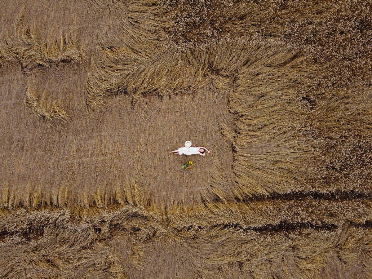 Aerial view of a pretty young woman enjoying the outdoors. girl wearing ...
