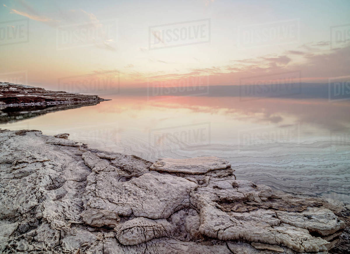 Salt formations on the shore of the Dead Sea at dusk, Karak Governorate ...