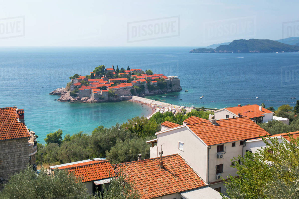 View over rooftops to Budva Bay and the exclusive island resort of ...