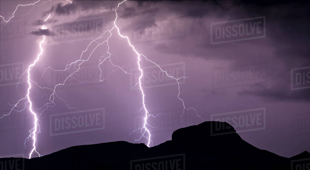 A panorama photo of lightning striking the slopes of Woolsey Peak ...