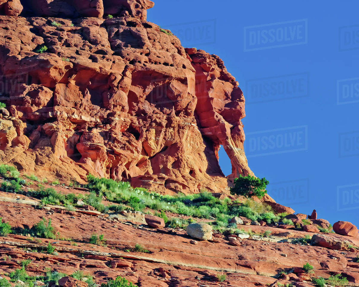 A famous rock arch formation in Sedona on the top of Mitten Ridge known ...