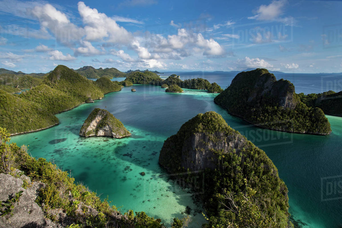 Aerial view of lagoon and karst limestone formations in Wayag Island ...
