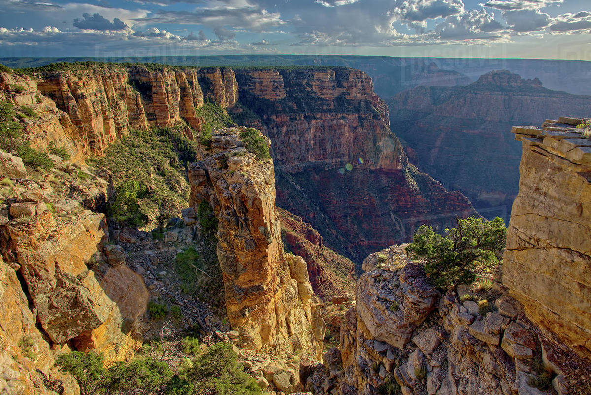 Pillars of rock standing just away from the cliff of the Grand Canyon ...
