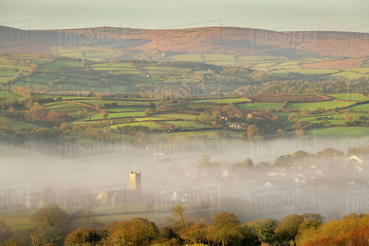 Misty winter morning view towards the church and Dartmoor village of ...