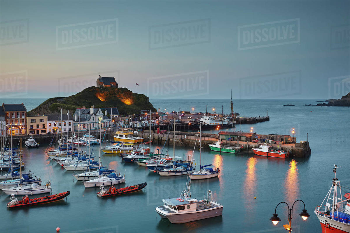 A classic dusk view of a north Devon fishing harbour at Ilfracombe, on ...