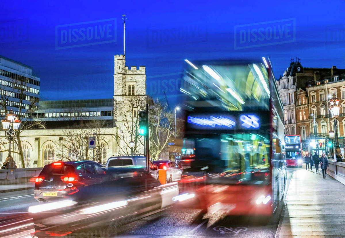 A London double-decker bus in moving traffic on Putney Bridge in the ...