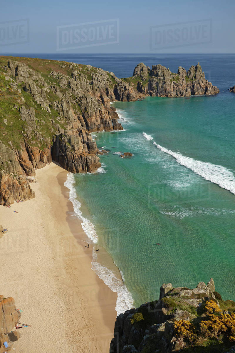 Iconic view from Treen cliffs, across the sands of Pedn Vaunder to the ...